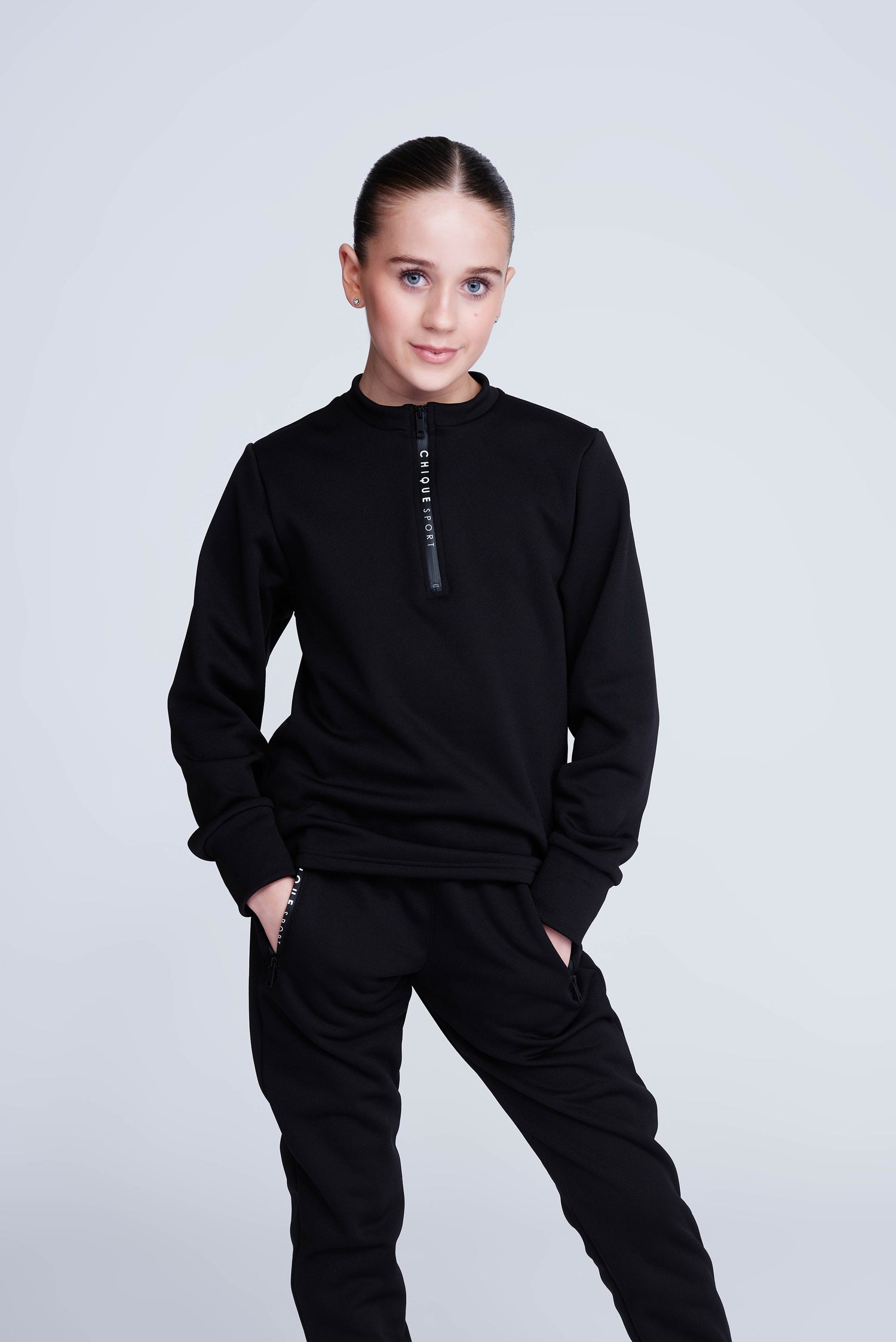 Girl's Figure Skating Ignite Half-Zip Top in Black | Chique Sport